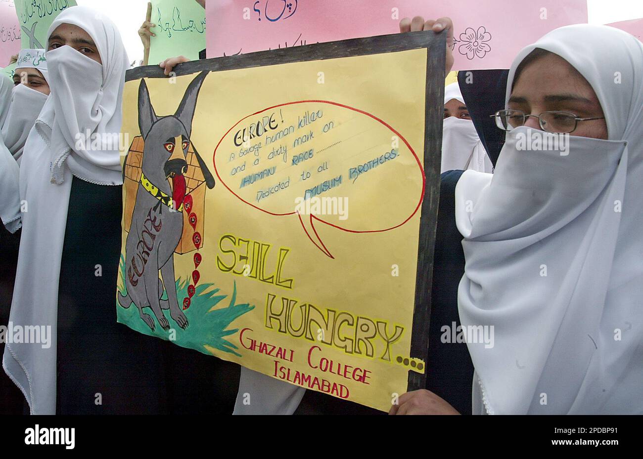 Pakistani veiled women supporters of a coalition of six radical Islamic ...