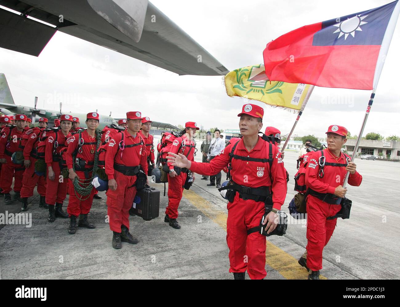 Taiwanese search and rescue team make a formation at a Philippine Air ...