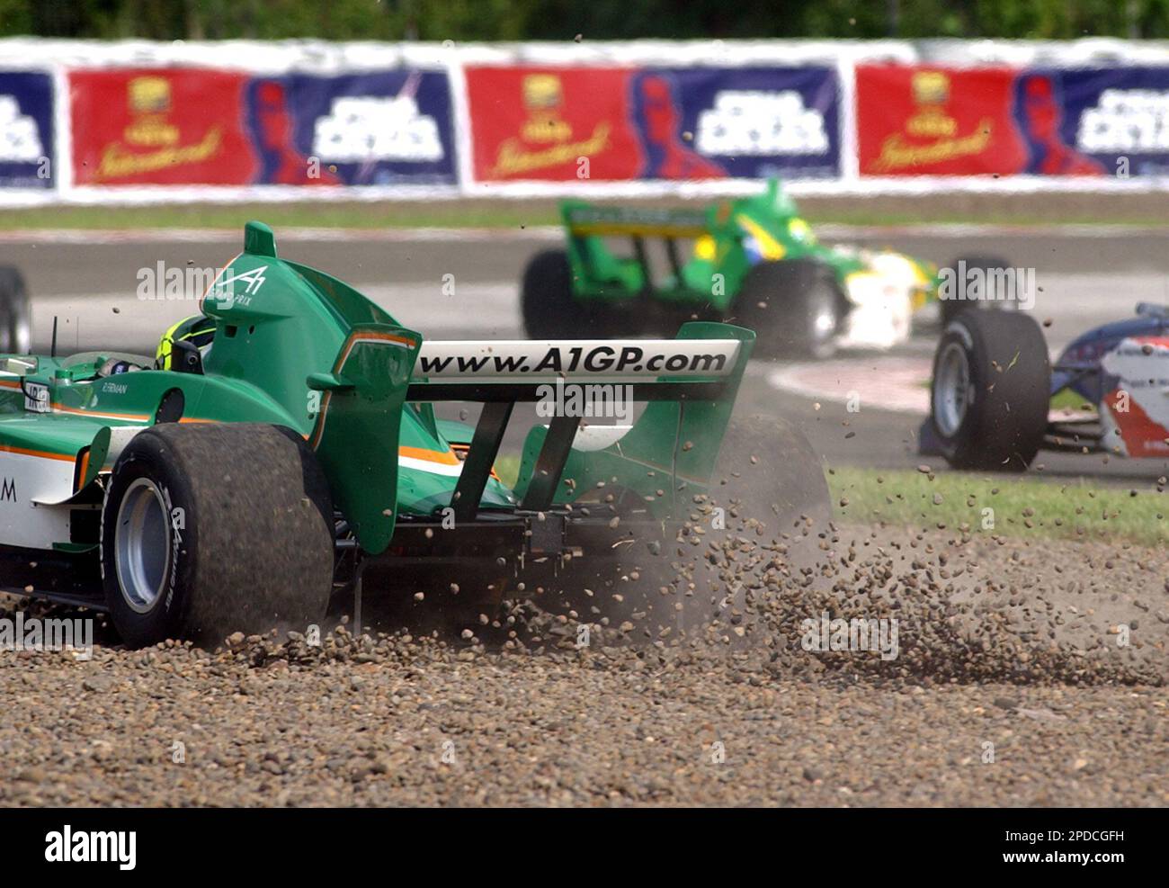 Pebbles are thrown backwards as Ireland's Ralph Firman, left, skids into the gravel during the ...