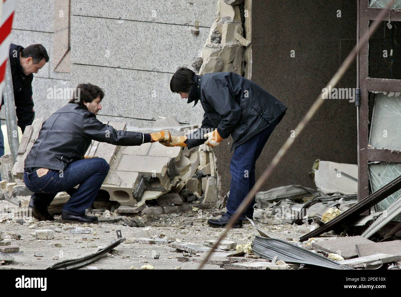 Basque police officers look for evidence next to a court building where ...