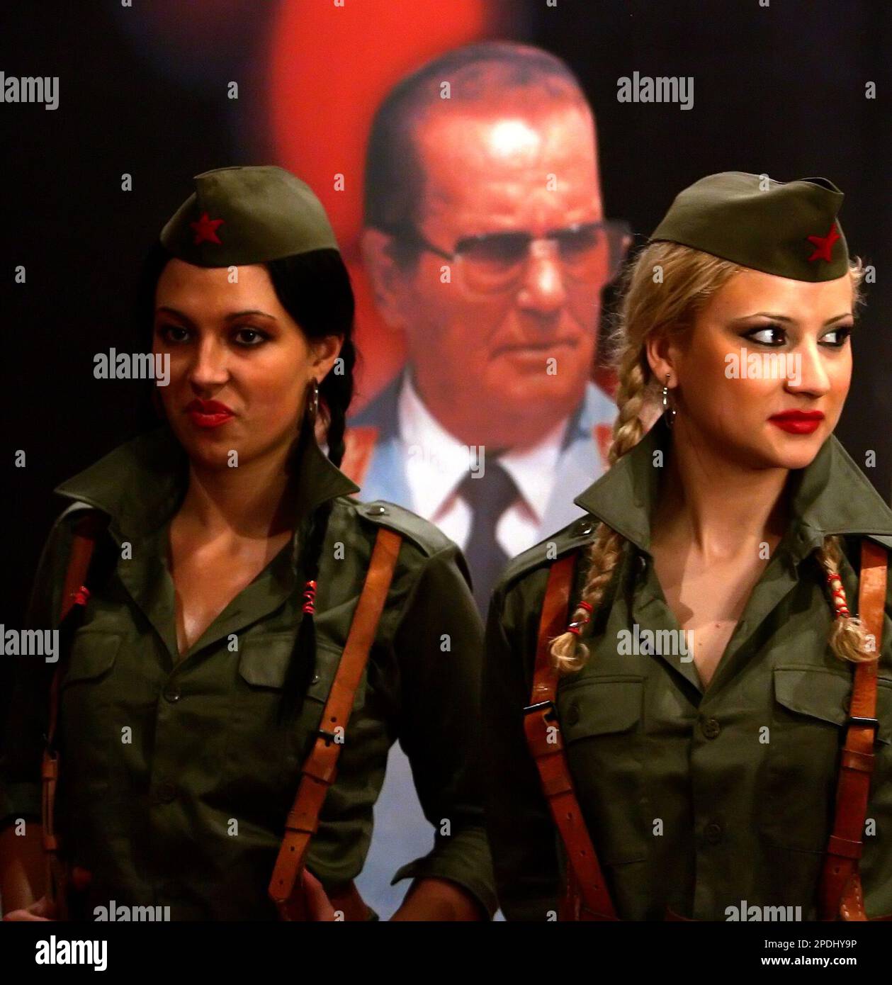 Girls in World War II guerrilla uniforms walk during the competition ...