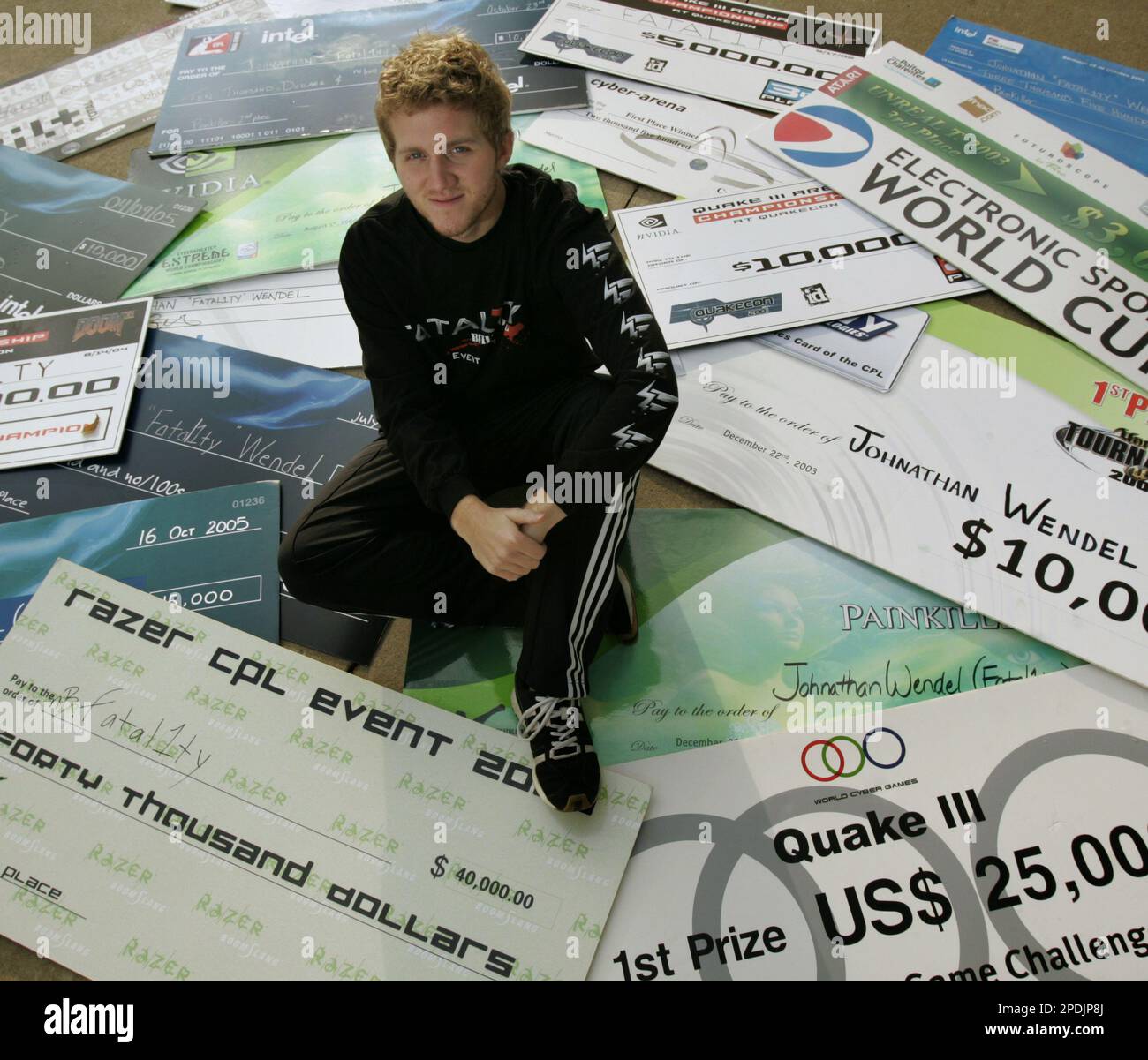 Jonathan Wendel, AKA Fatality, sits amongst presentation checks from ...