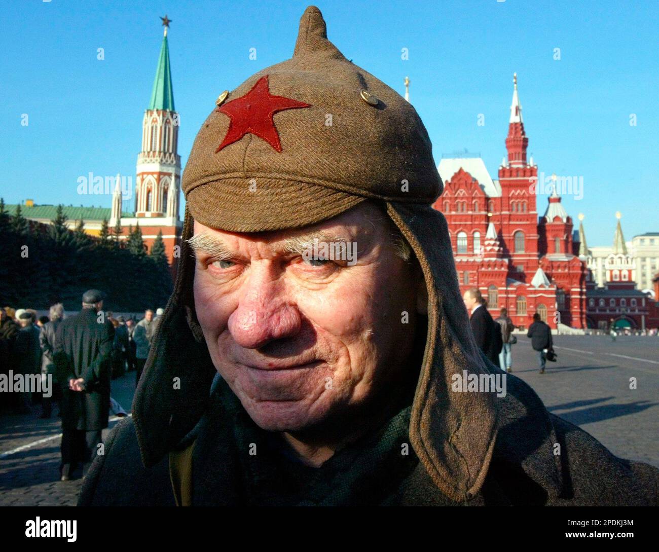 An elderly Communist Party activist wearing a modern replica of a ...