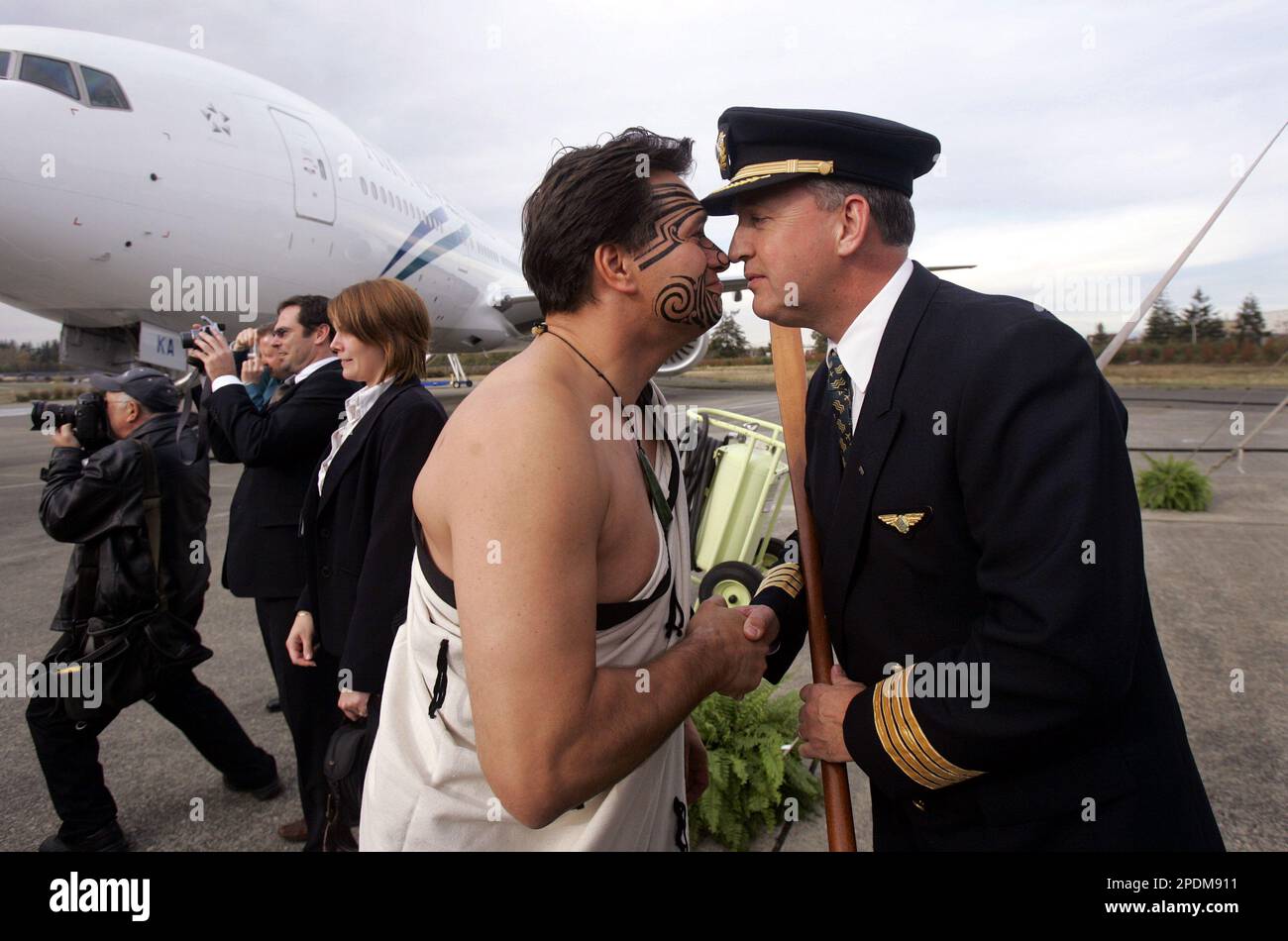 Andrew Baker, left, begins to touch noses with Air New Zealand pilot ...