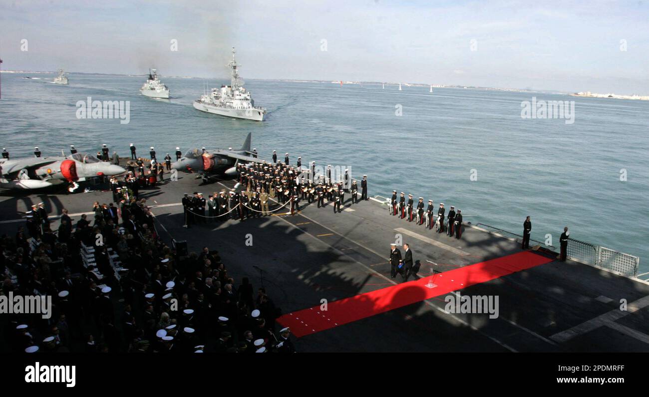 Spanish naval crew members and invited guests watch from aboard the ...