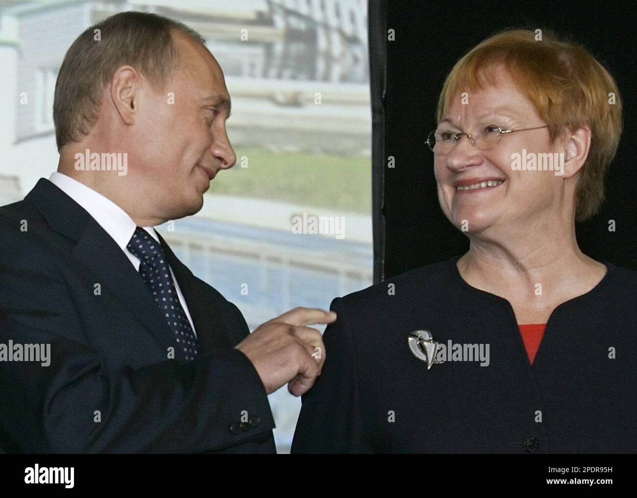 President Vladimir Putin, left, and Finnish President Tarja Halonen ...
