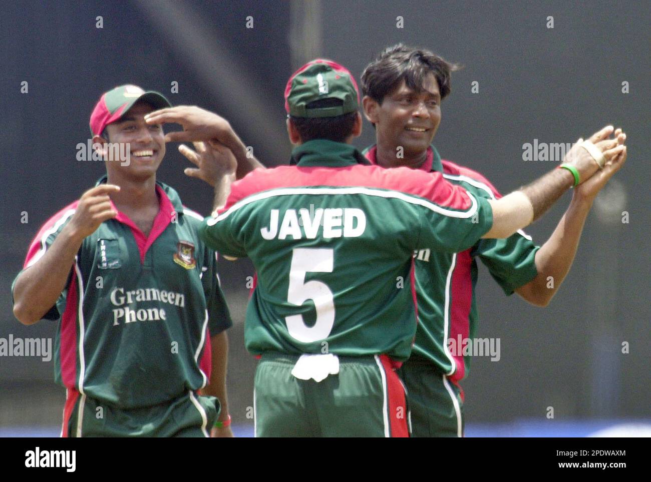 Bangladeshi bowler Mohammed Rafique, right, celebrates the dismissal of ...