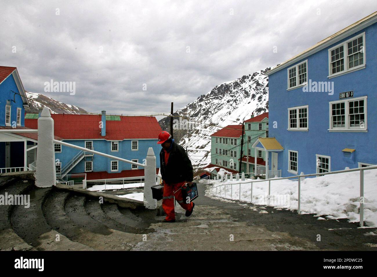 A miner walks down one of the rock stairs that exist instead of streets ...