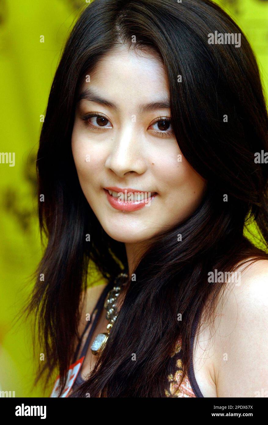 Hong Kong singer-actress Kelly Chen poses for the photographers before a radio interview in Hong ...