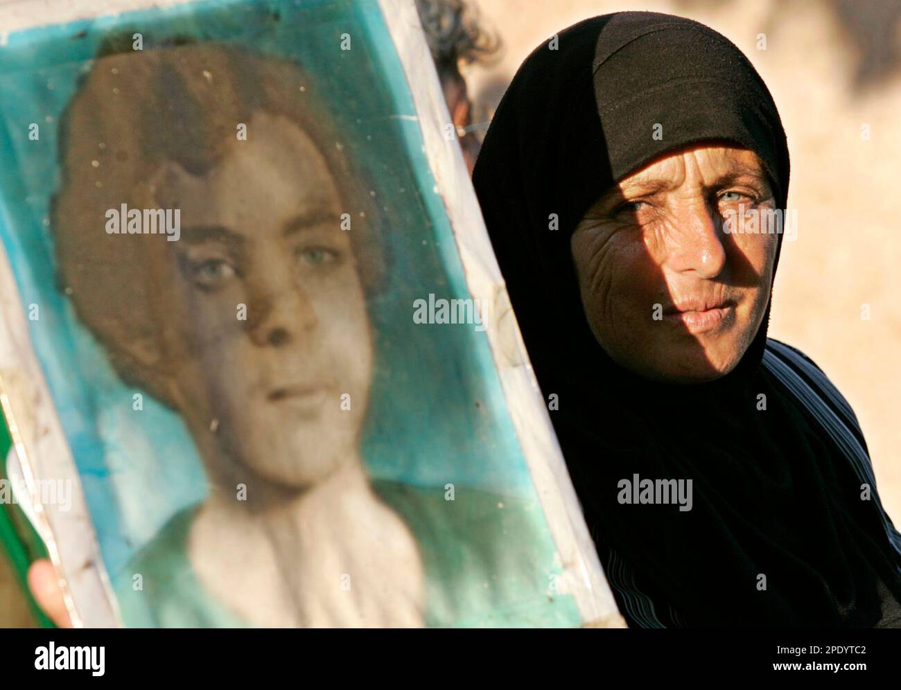 Lebanese Majida Bashasha holds a picture of her brother Ahmad Bashasha ...