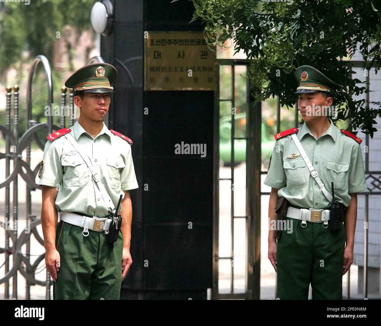 Chinese military police officers stand guard outside the North Korean ...