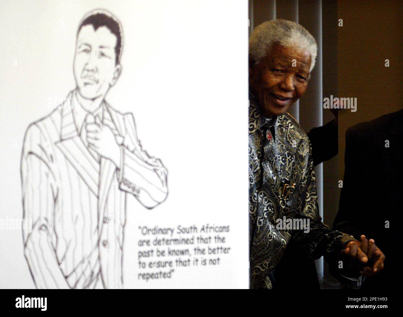 Former South African President Nelson Mandela, alongside an image of ...
