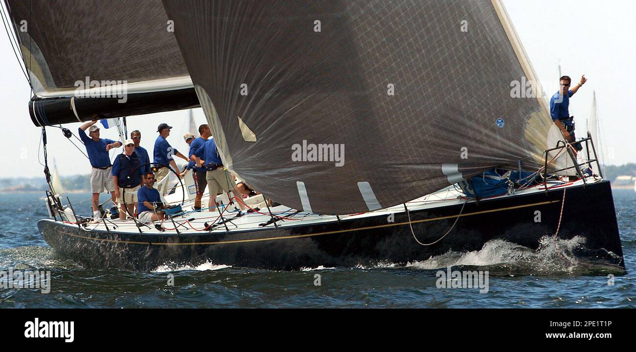 Crew members from the U.S. boat Captivity, owned by Sam Byrne, sail ...