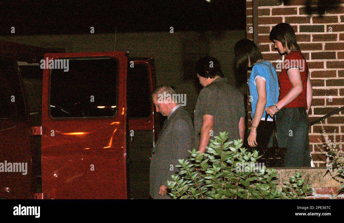 Charles Robert Jenkins, left, leads his family as they depart his ...