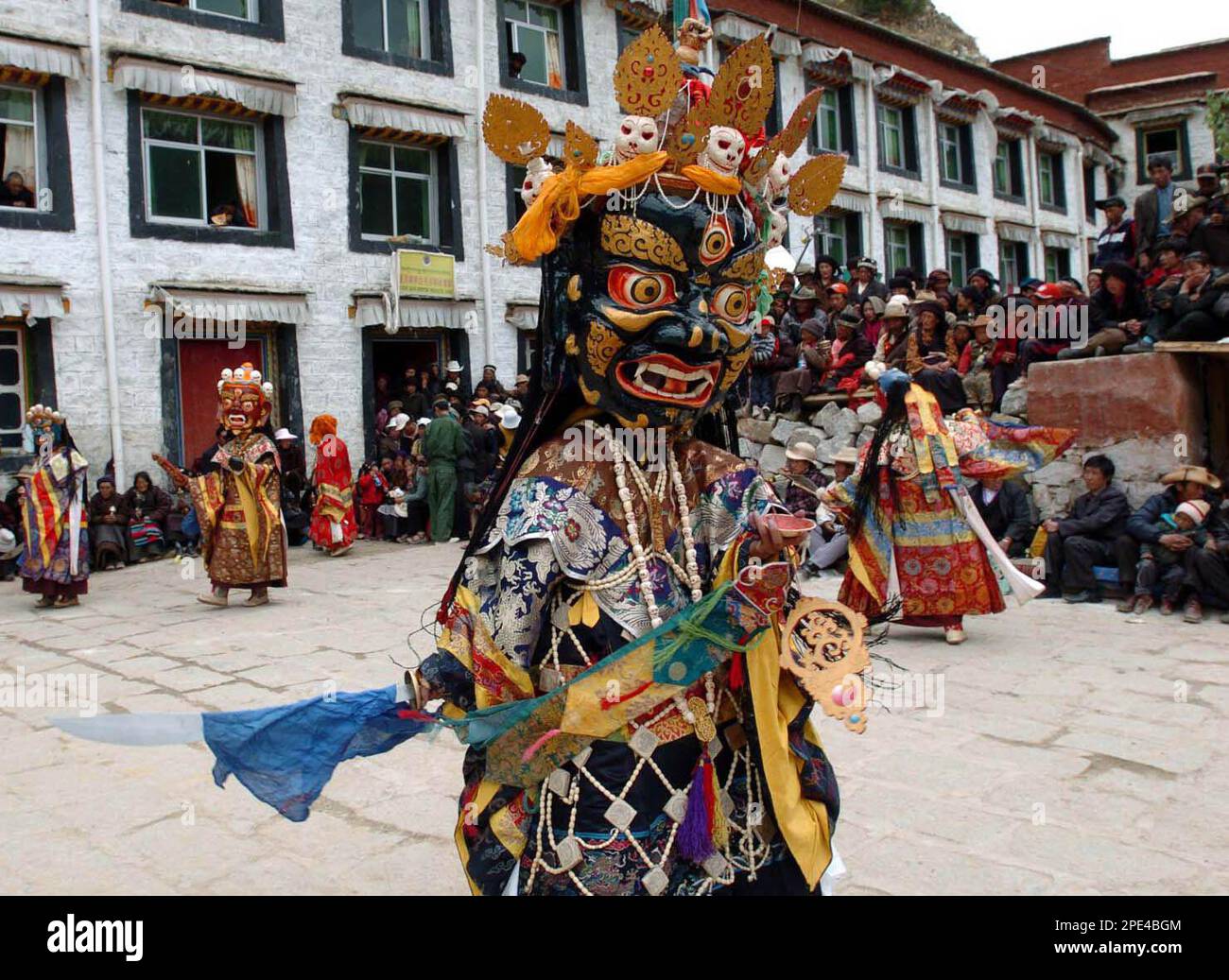 Lamas wearing masks dance at the Jumping Deities ceremony in the ...