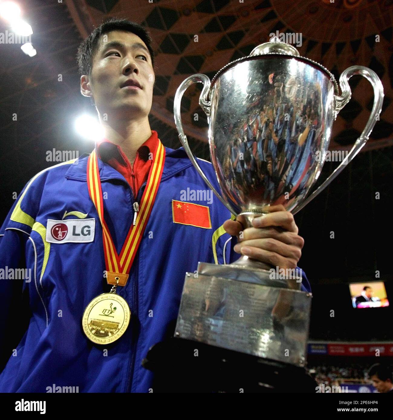 China's Wang Liqin holds his trophy after winning the mens' singles final at the 48th World ...
