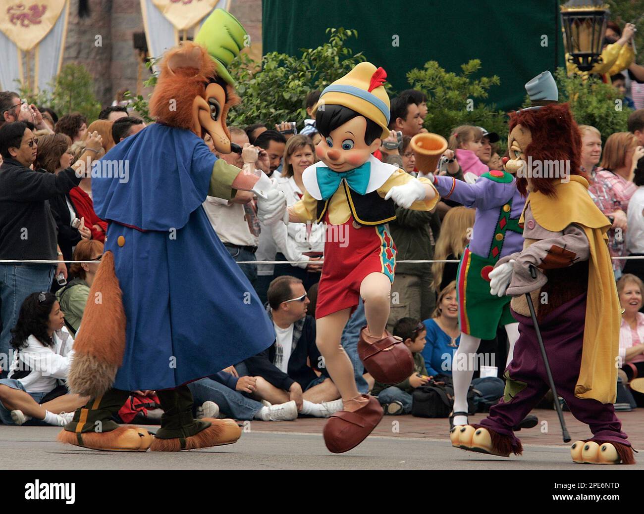 Disney characters Foulfellow, left, Pinocchio, middle, and Giddon ...