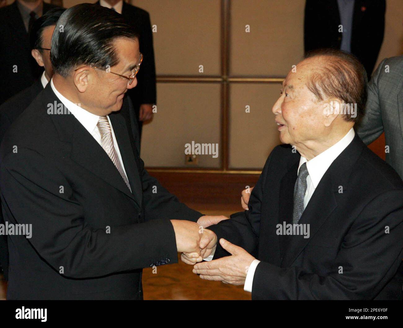 Taiwan's Nationalist Party Chairman Lien Chan, left, is greeted by Wang ...