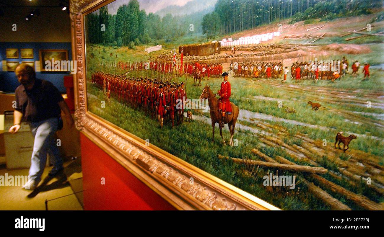 A worker walks by the painting "A Charming Field For An Encounter" by ...