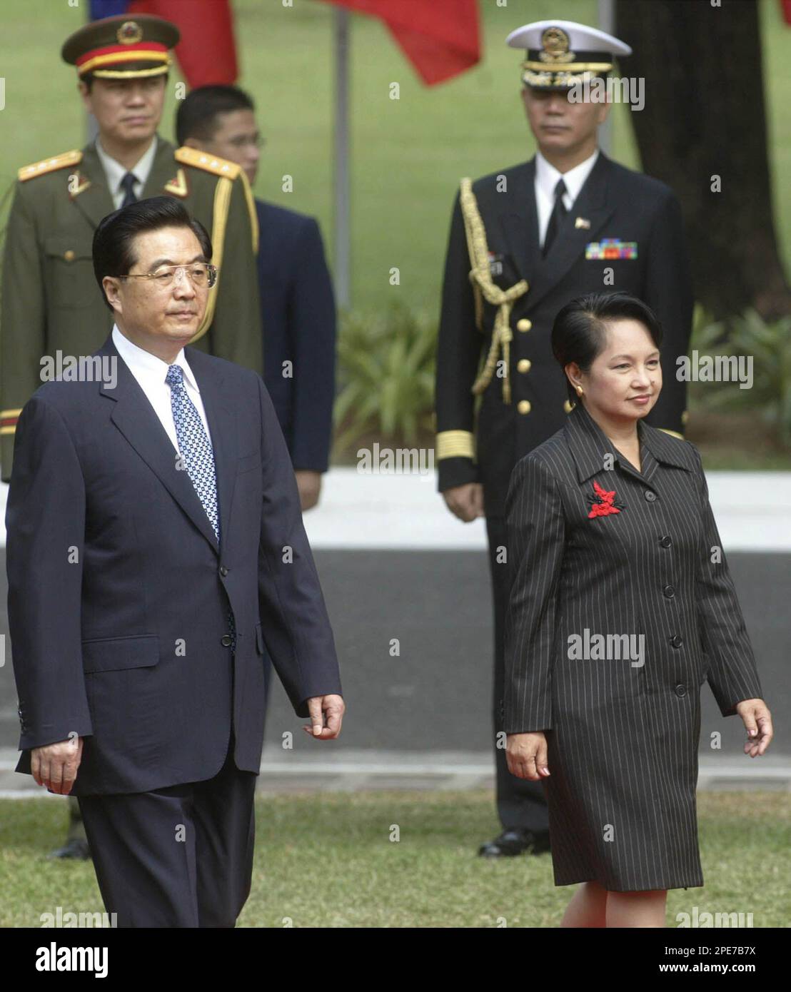 Chinese President Hu Jintao, left, is escorted by Philippine President ...