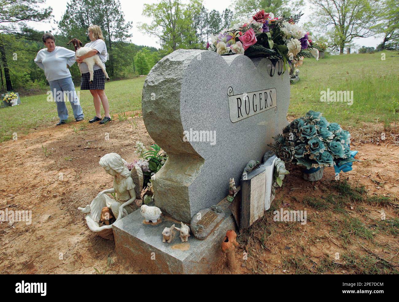Cheryl Rogers holds her son Kyle's pet goat while talking to her mother, Carolyn Horn, at the ...