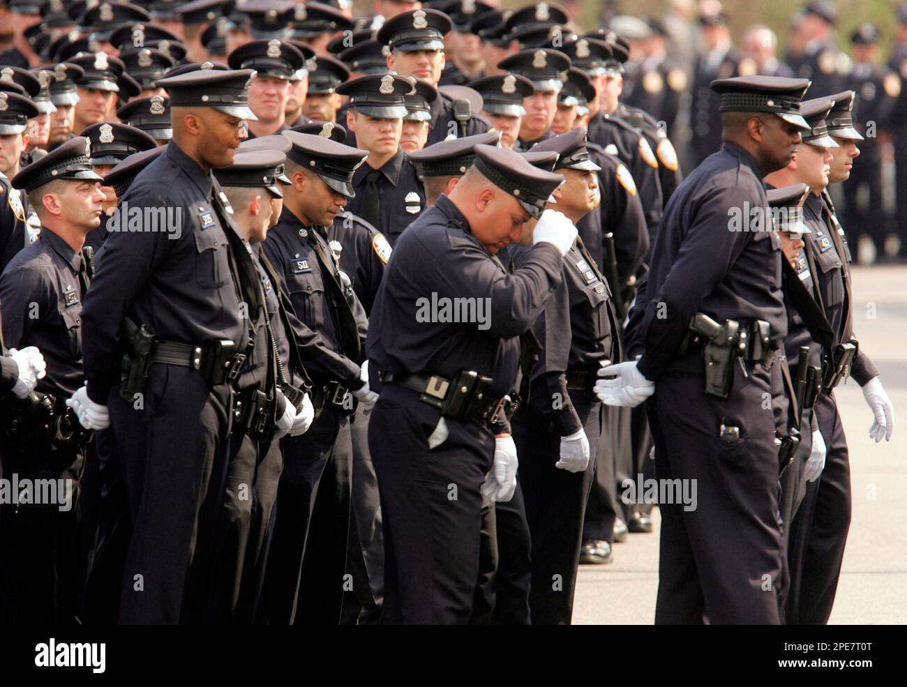 Providence, R.I. police officers assemble outside the Nardolillo ...