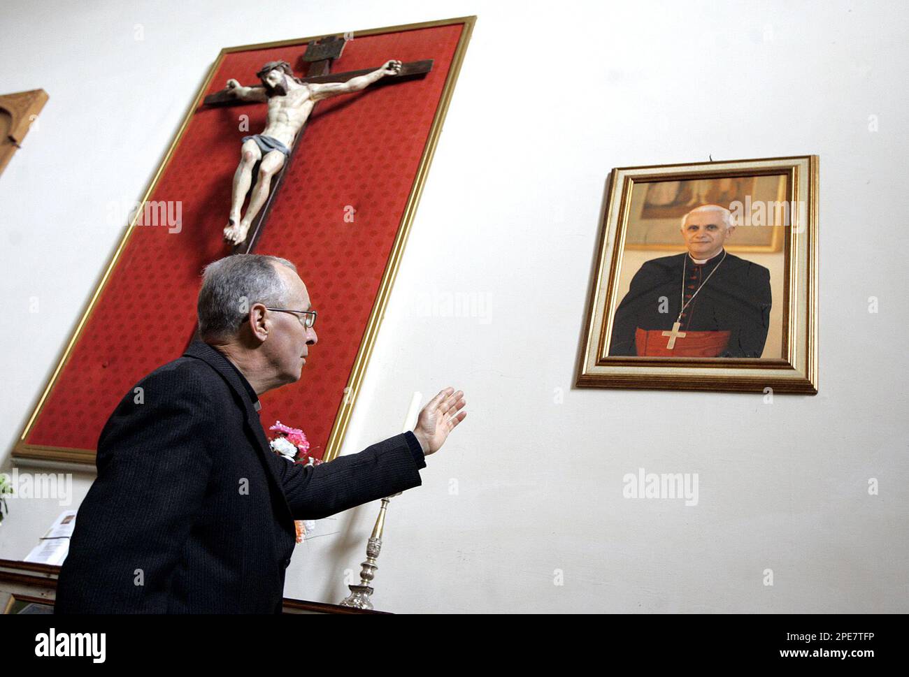 Monsignor Franco Risi shows the portrait of Pope Benedict XVI, former ...