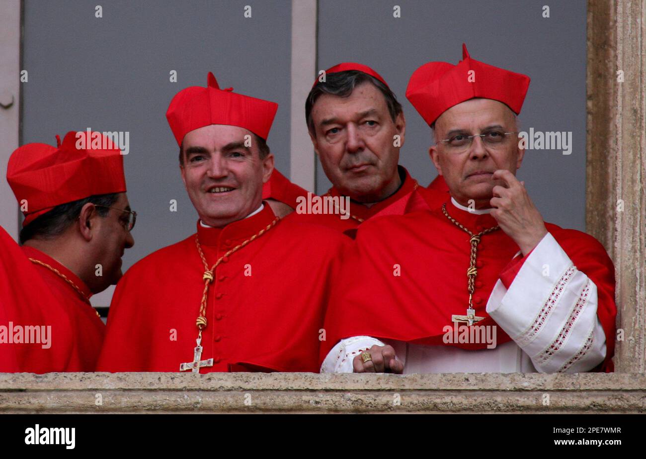 US Cardinal Francis Eugene George, right, reacts as fellow Cardinals ...