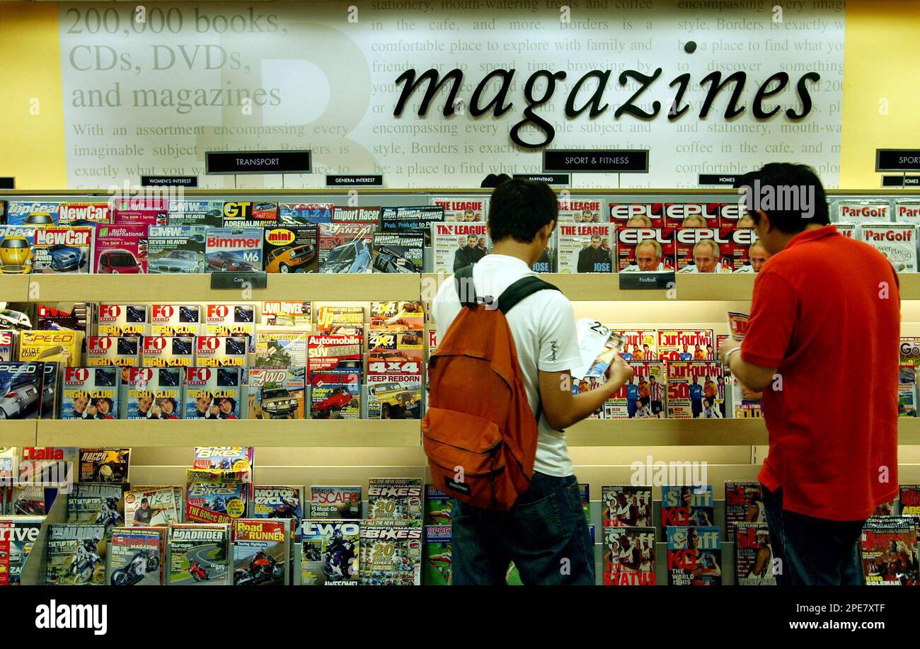Shoppers reads magazines at the newly opened bookstore at a shopping ...