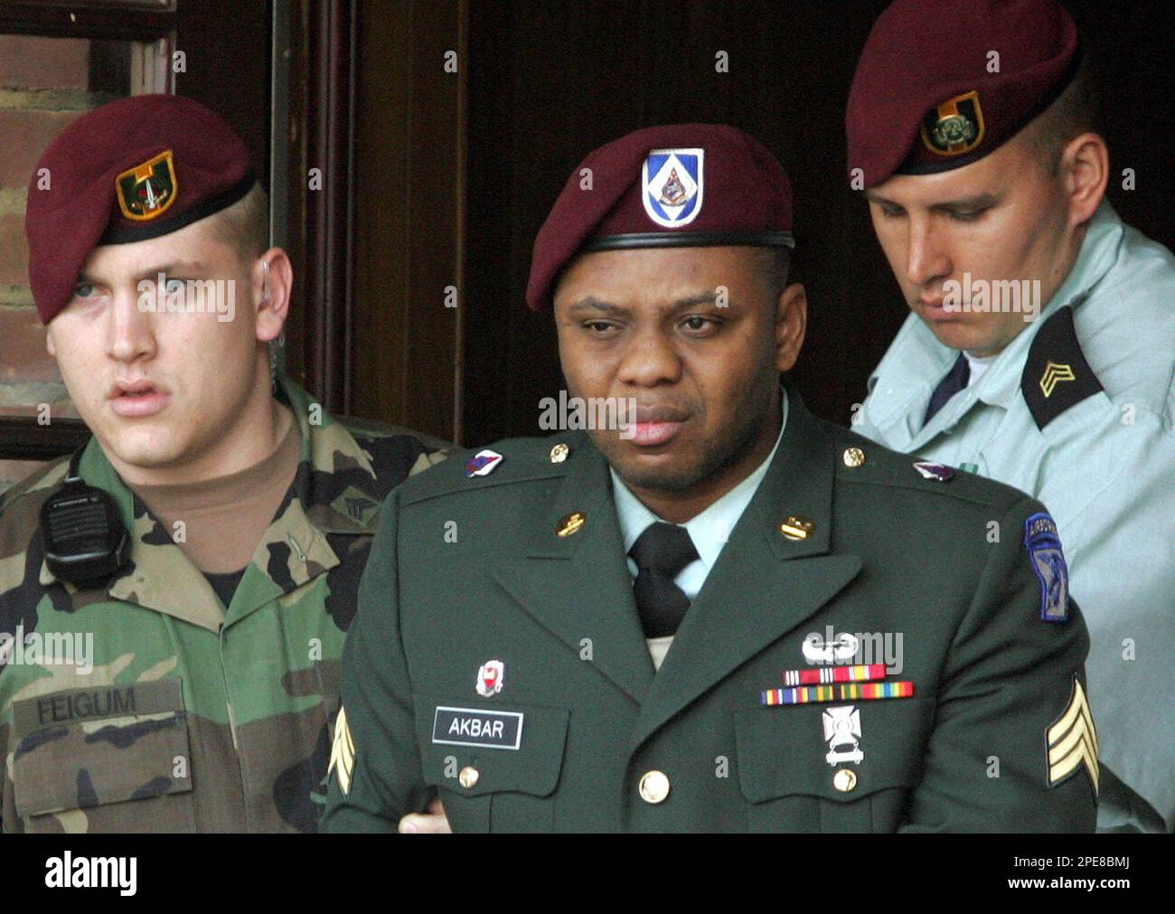 Sgt. Hasan Akbar, center, is led from the Staff Judge Advocate Building ...