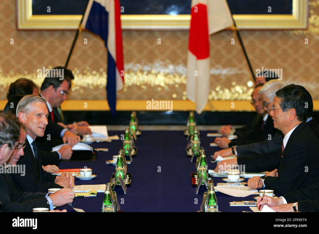 Dutch Foreign Minister Bernard Bot, third from left, faces with his Japanese counterpart ...