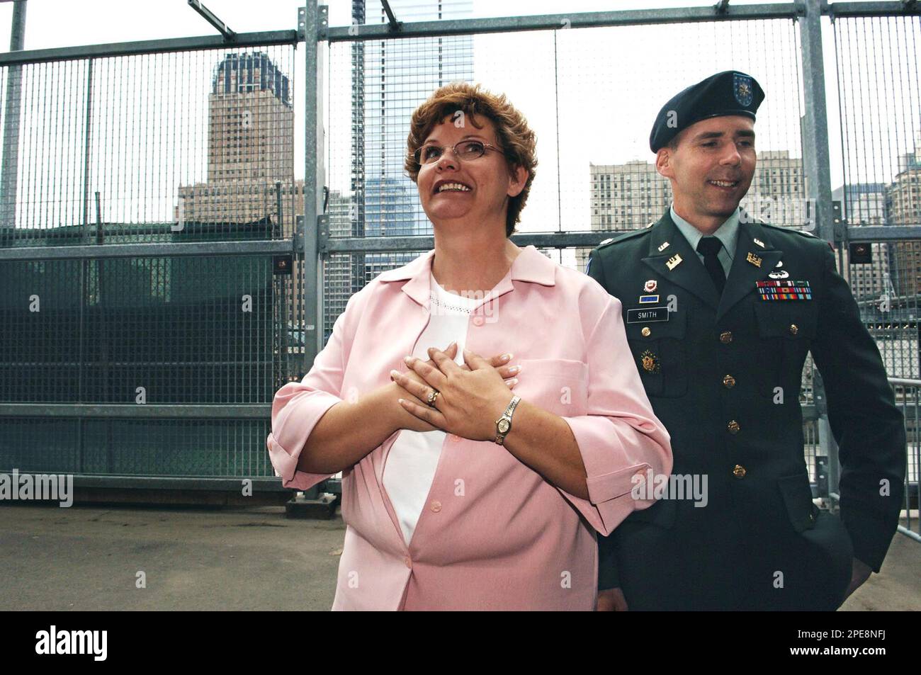 Birgit Smith speaks to the media with Lt. Col. Thomas P. Smith by her side at the site of the ...