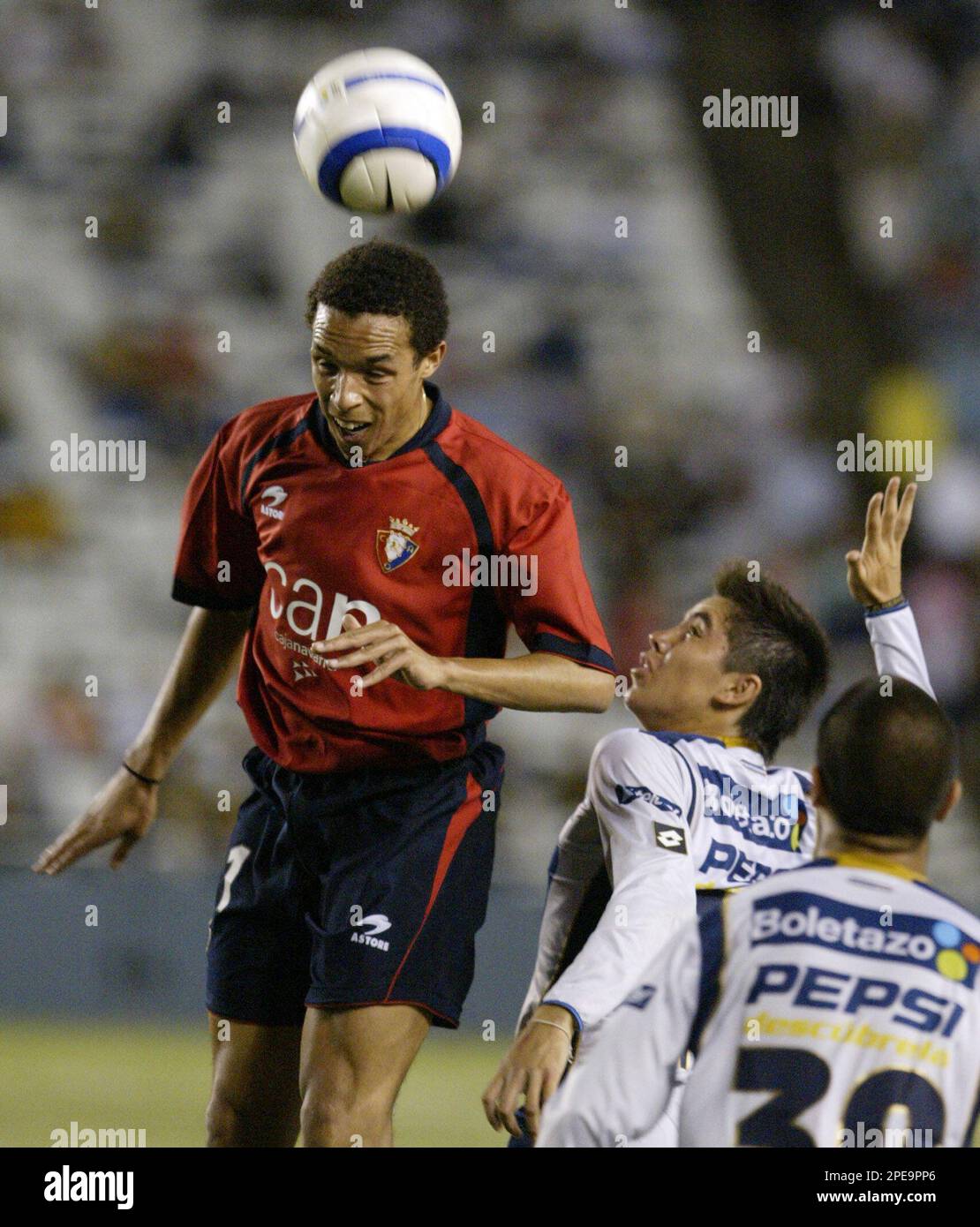 Osasuna's Valmiro Lopez Rocha, left, of Spain, heads the ball while ...