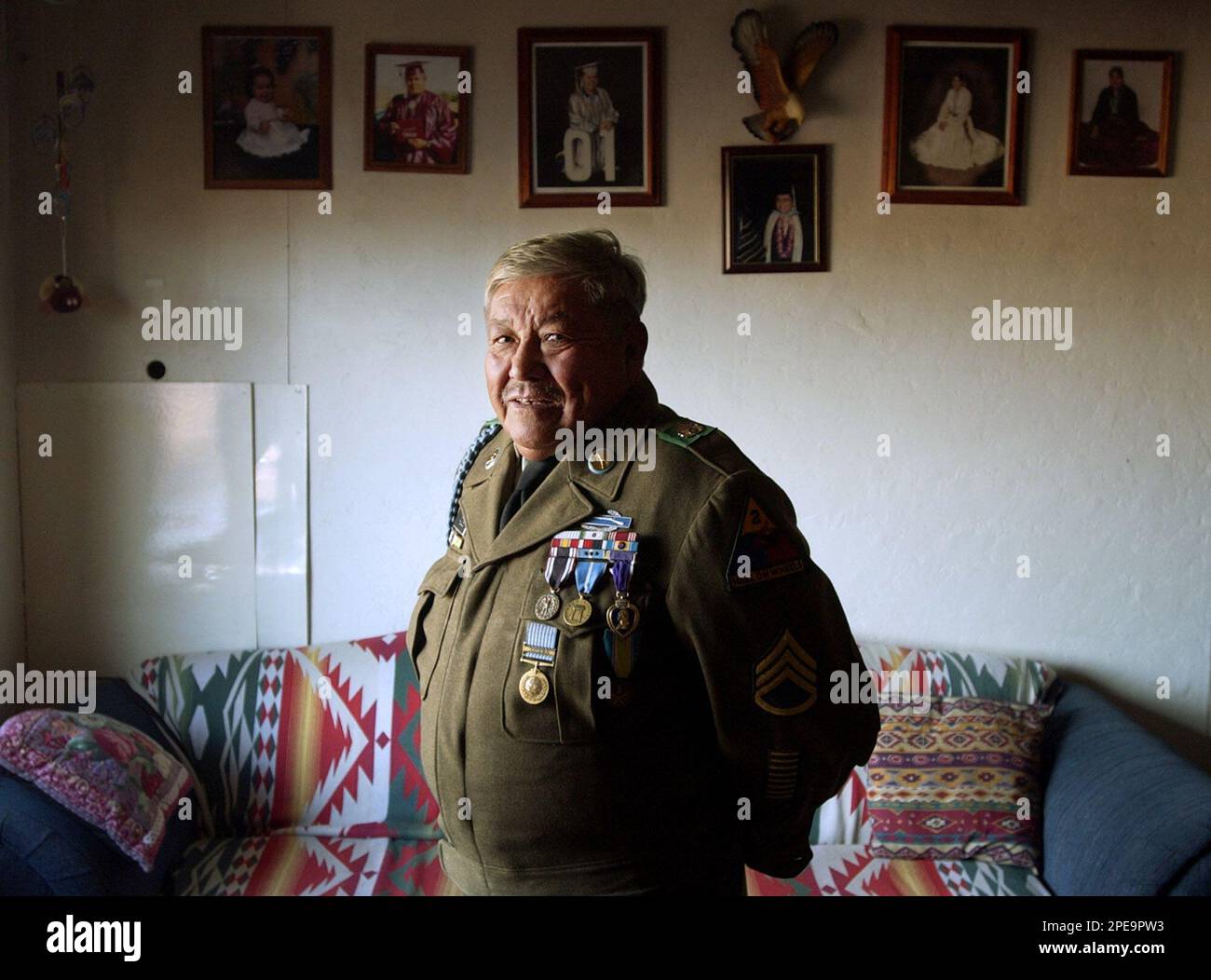 Native American and former Korean War POW Glenn Yazzie, poses in his ...