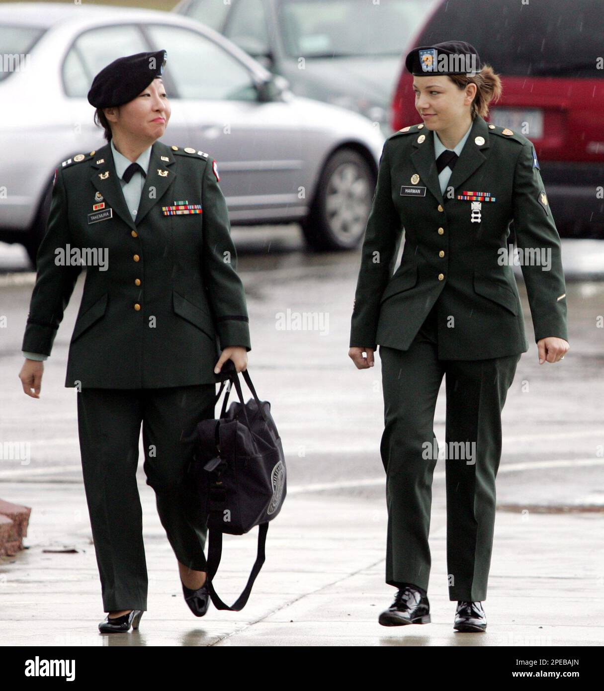 Spc. Sabrina D. Harman, right, and her attorney Capt. Patsy Takemura ...