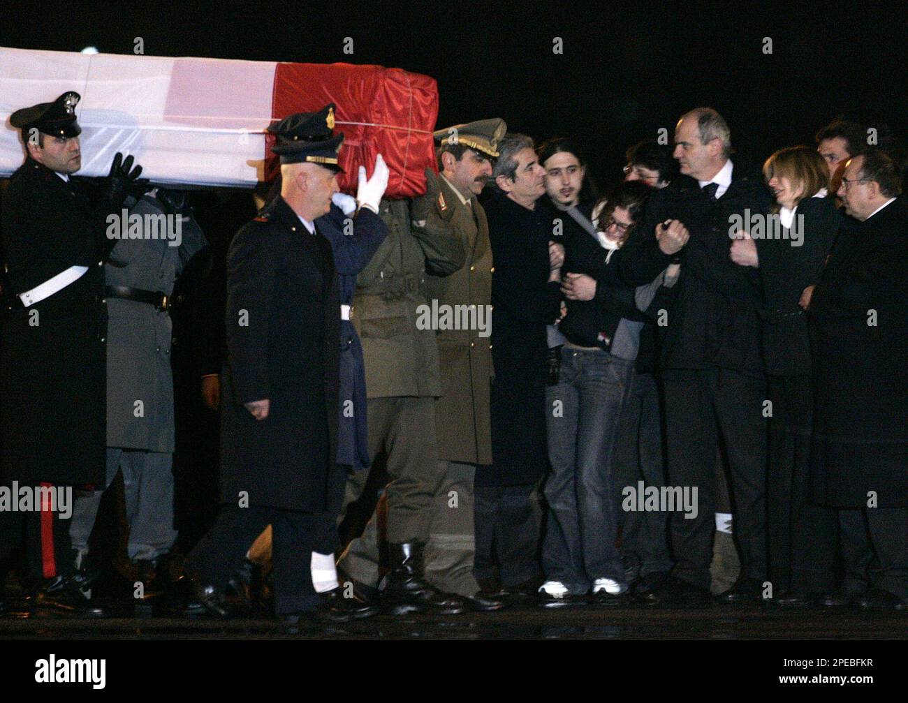 Relatives of Italian intelligence officer Nicola Calipari react as they ...