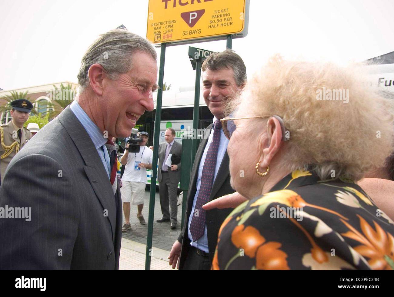 Britain's Prince Charles, left, smiles as he talks with a woman at the ...