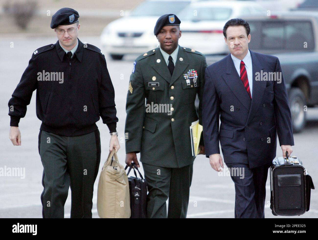 U.S. Army Sgt. Javal S. Davis, center, with his attorney Paul Bergrin ...