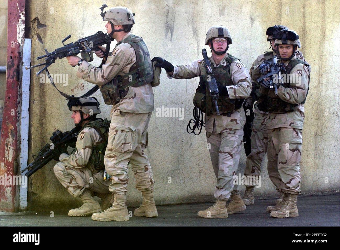 U.S. Army 1st Battalion, 24th Infantry soldiers raid a gas station in ...