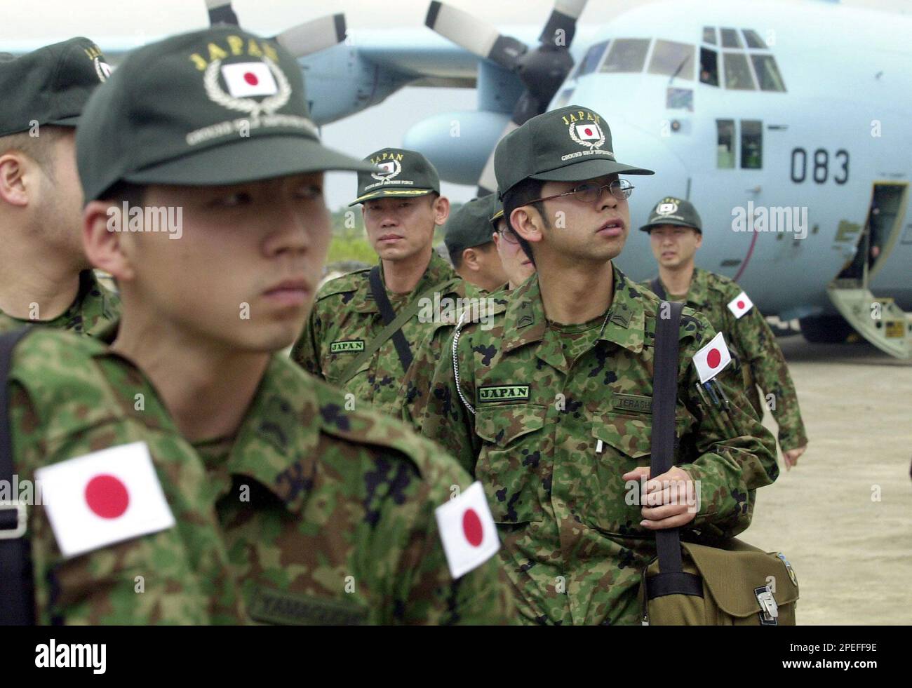 Japanese military medical team march upon their arrival in Banda Aceh ...