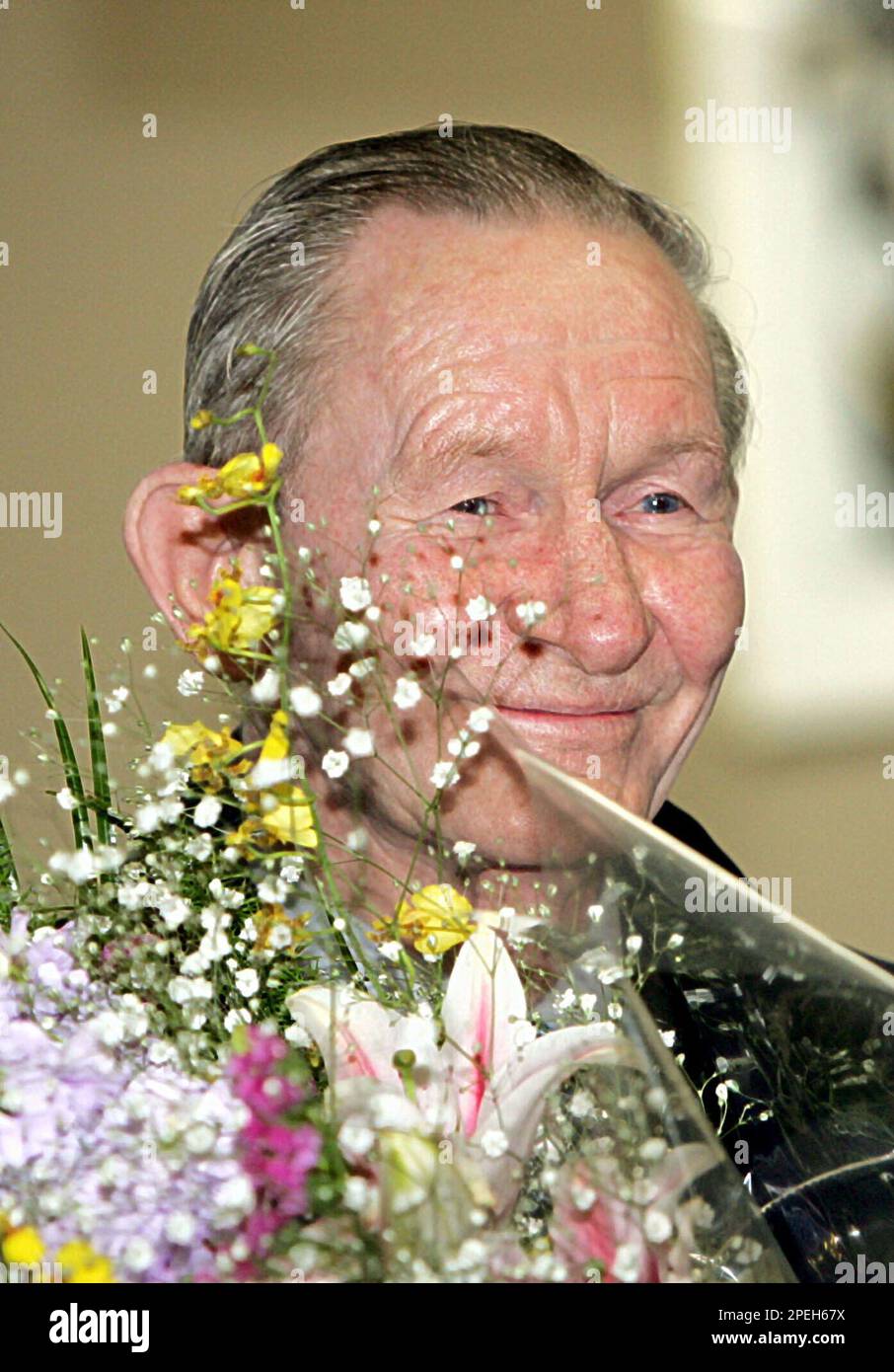 Former U.S. Army deserter Charles Jenkins smiles with a bouquet of ...