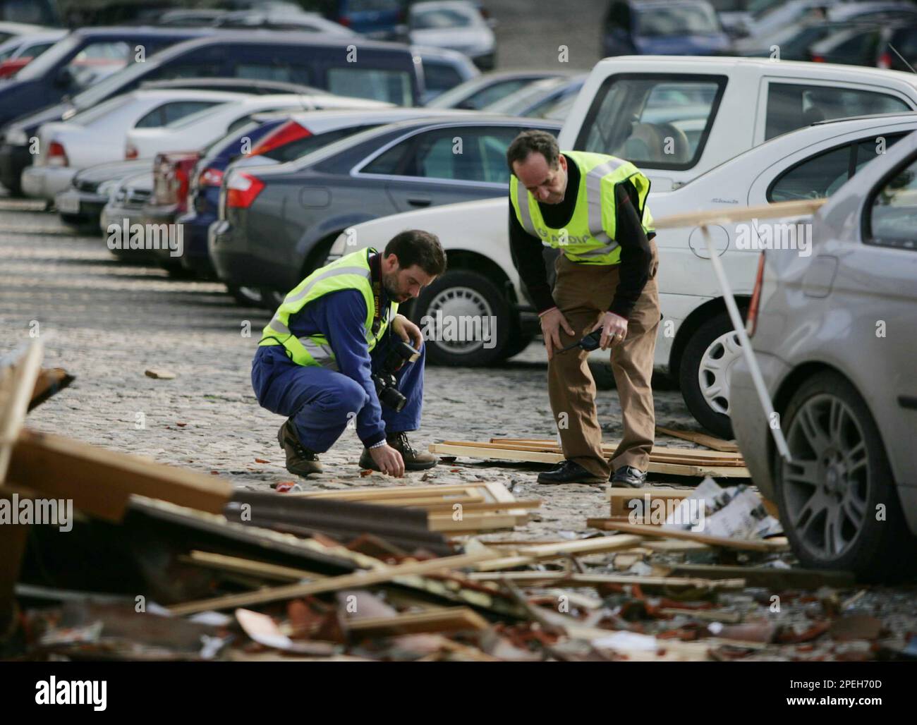 Explosives experts work at the scene after a bomb exploded in ...