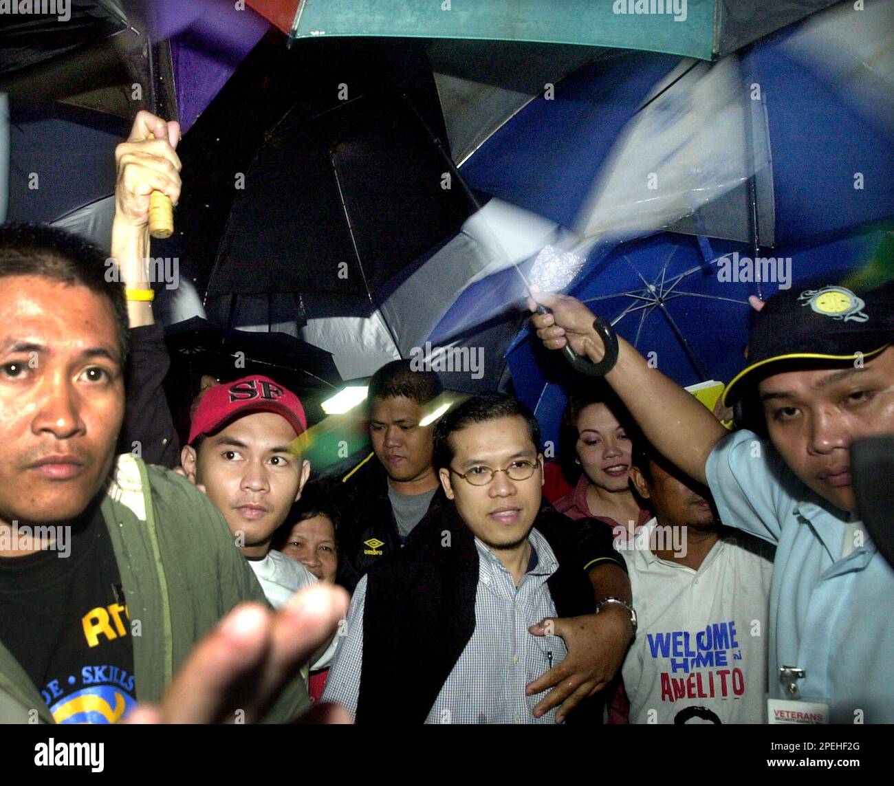 Freed Filipino hostage Angelito Nayan, center wearing glasses, is ...