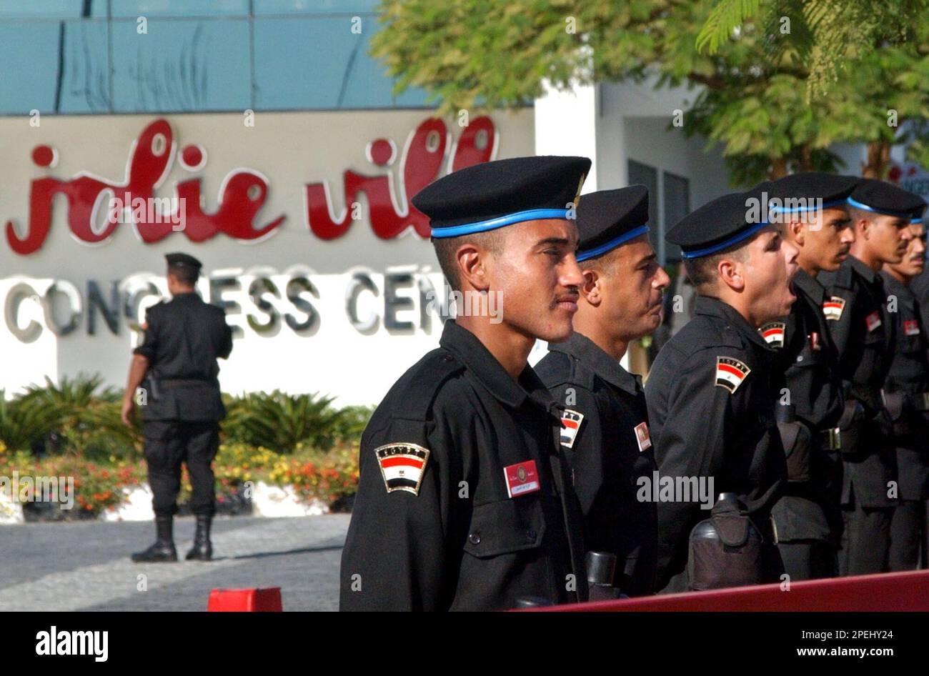 Egyptian policemen line up in front of the Jolie Ville Congress Center ...