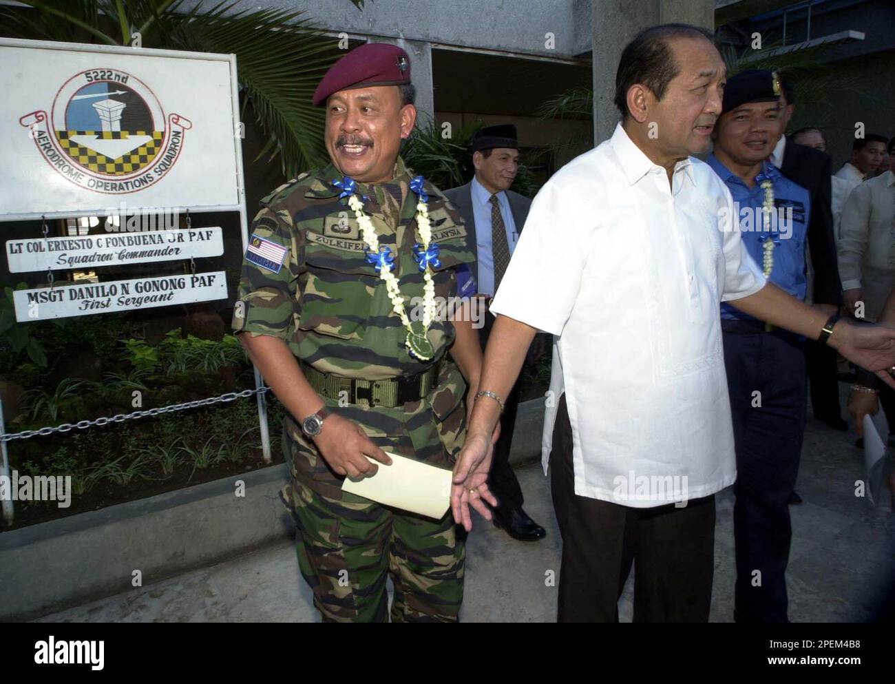 Executive Secretary Eduardo Ermita gestures before the start of the ...