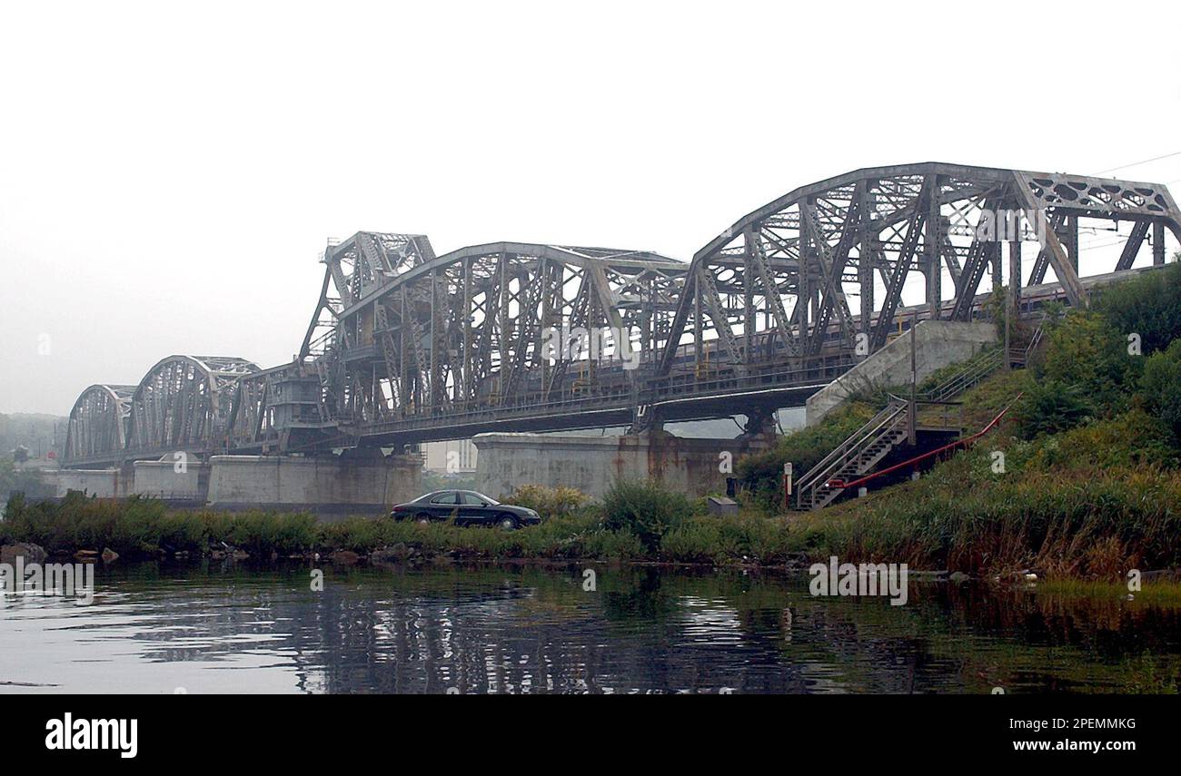 A train goes over the Thames River Bridge in New London, Conn., Tuesday ...