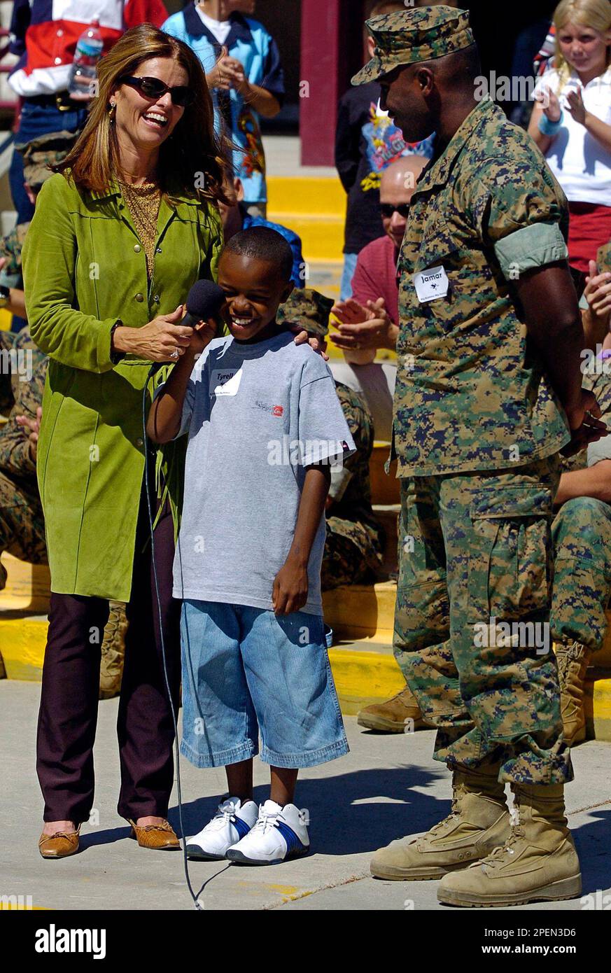 California First Lady Maria Shriver, left, talks with Tyrell, center ...
