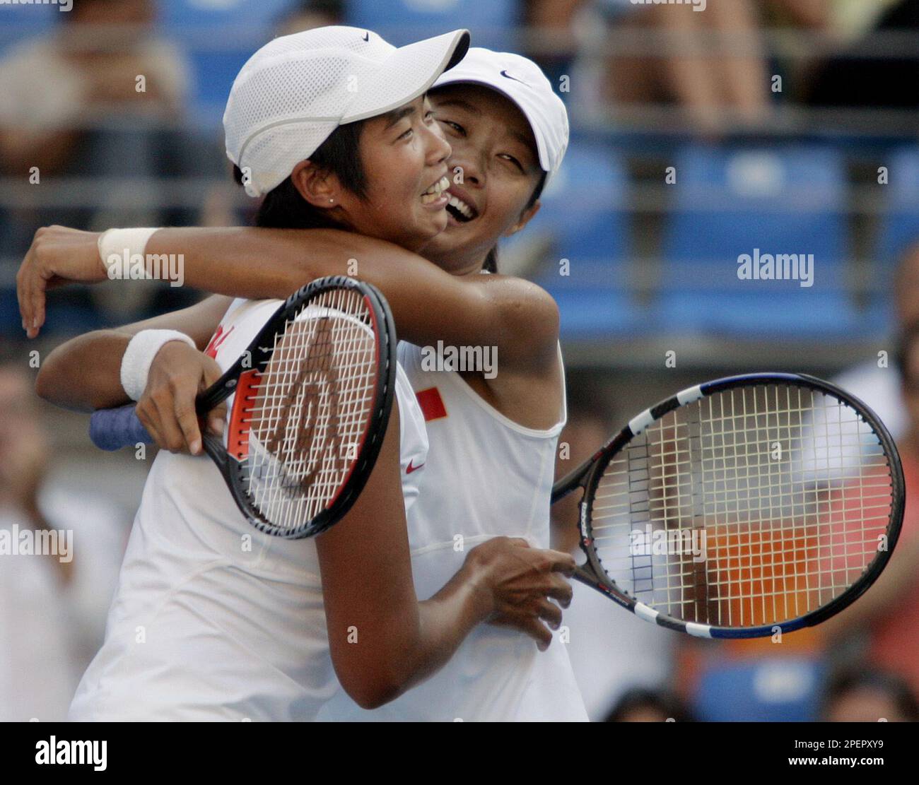 China's Li Ting, left, and doubles partner Sun Tian Tian celebrate ...