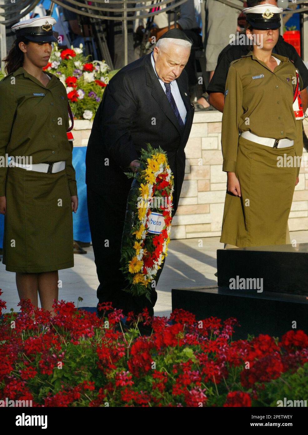 Israeli Prime Minister Ariel Sharon lays a wreath on the grave of Likud ...