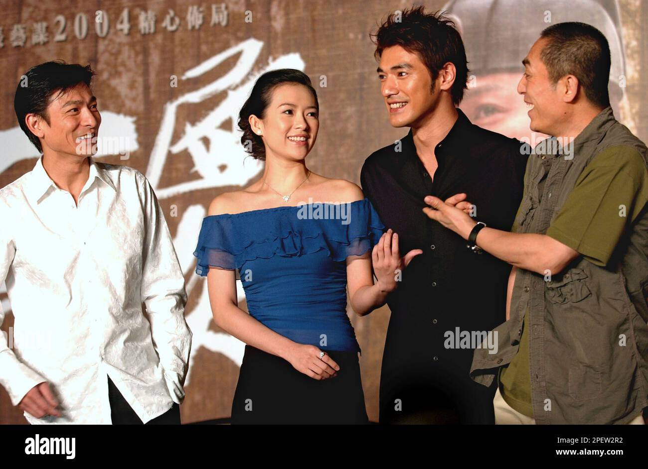 Chinese movie star Zhang Ziyi, second left, jokes with film director ...